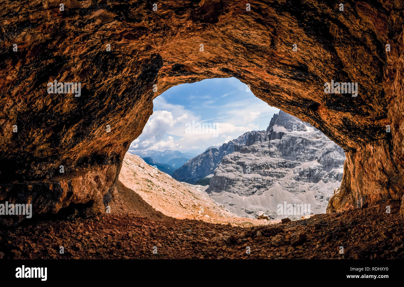 View from cave entrance in Italian Dolomites with their typical rocky ...