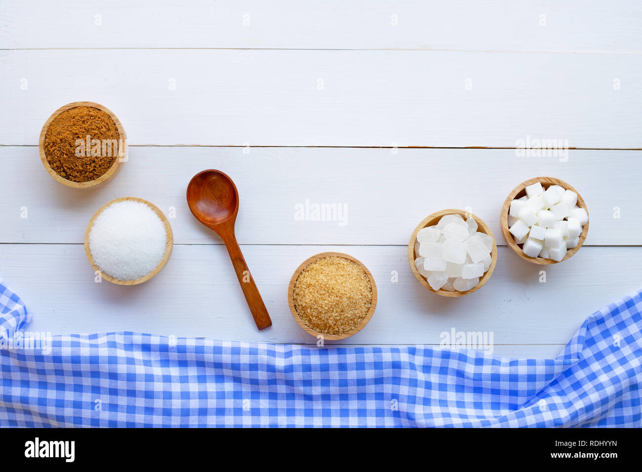 Various types of sugar on wooden background Stock Photo - Alamy