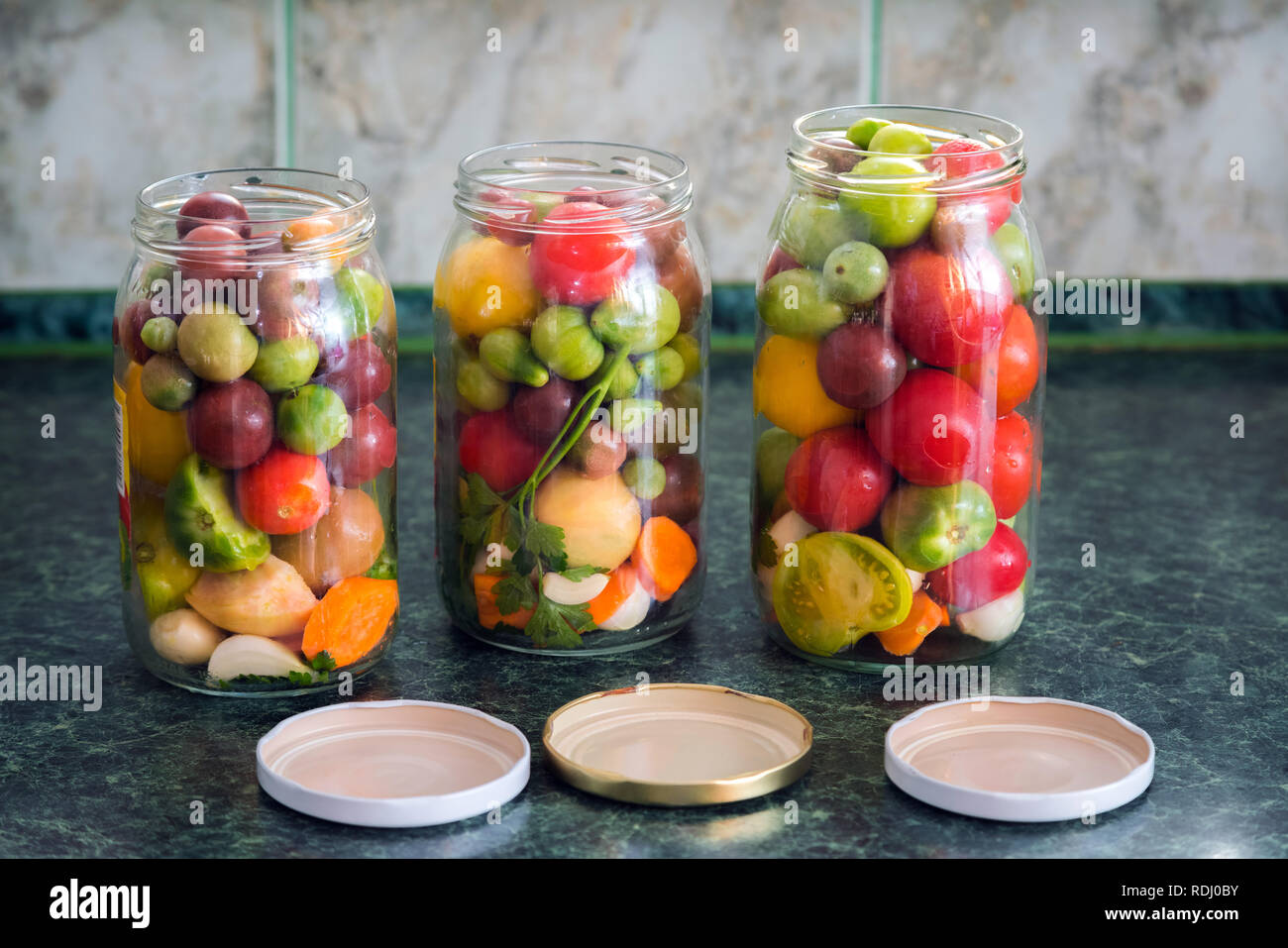 Jars of pickled vegetables. Traditional marinated food - tomatoes ...