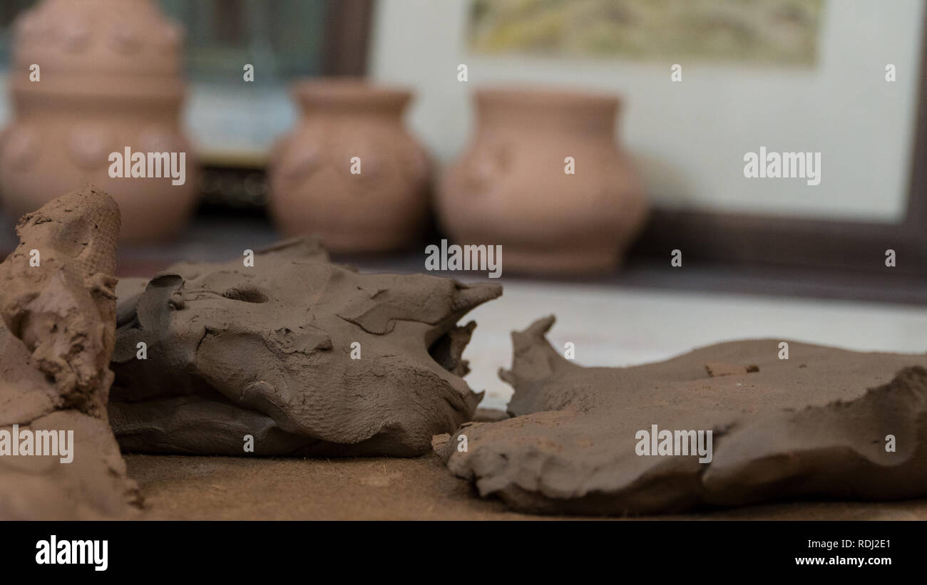 close-up of pottery clay on blurred background of pots. children's ...