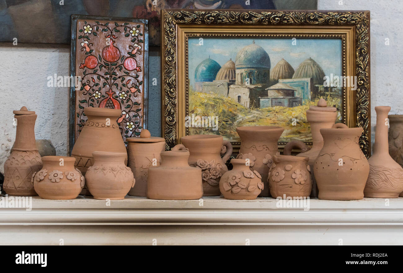 row clay pots on the background of paintings. children's crafts Stock ...
