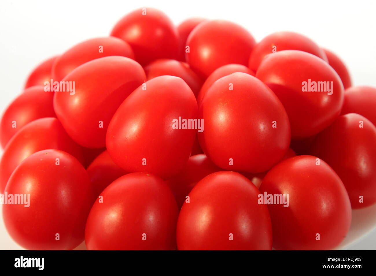 Red tomato food background concept Stock Photo - Alamy