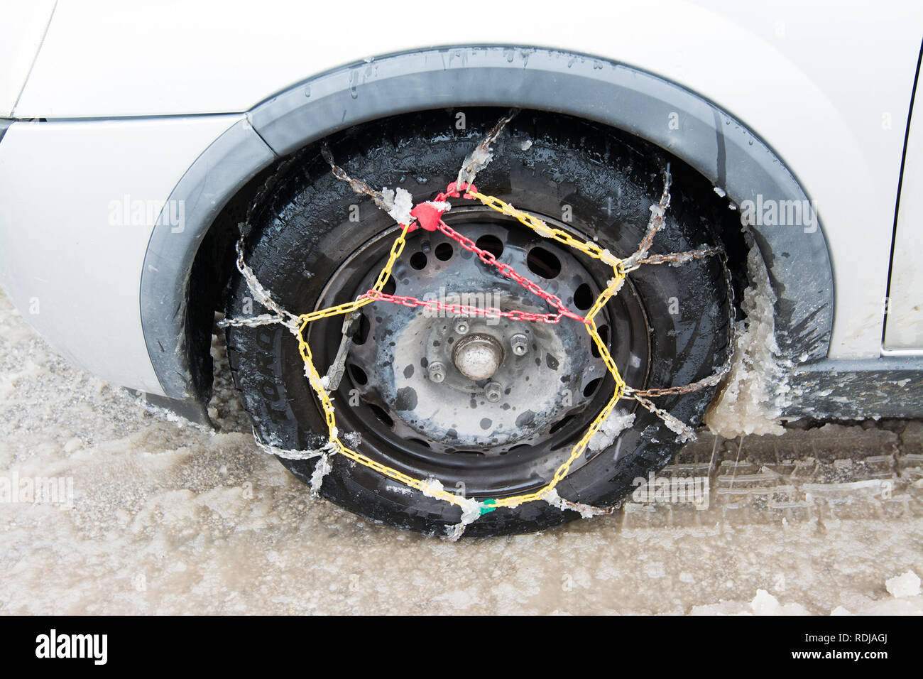 Tire With Mounted Old Snow Chains in the Winter Snowy Day Stock Photo ...