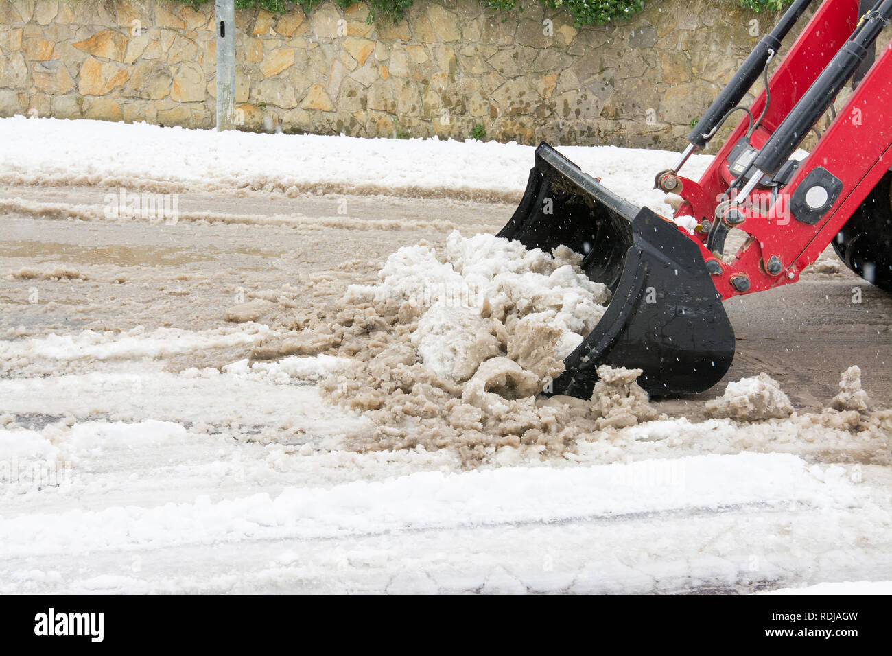 Wheel loader machine removing snow in winter on the road Stock Photo ...