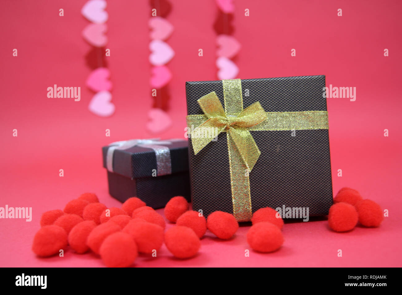 Gift box with red theme Stock Photo - Alamy