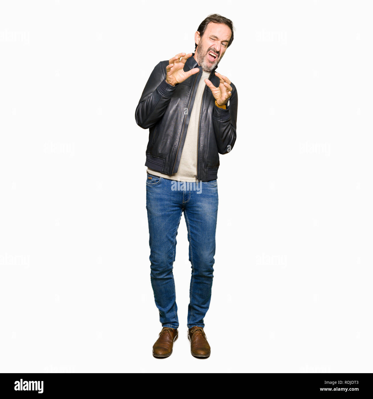Middle age handsome man wearing black leather jacket disgusted ...