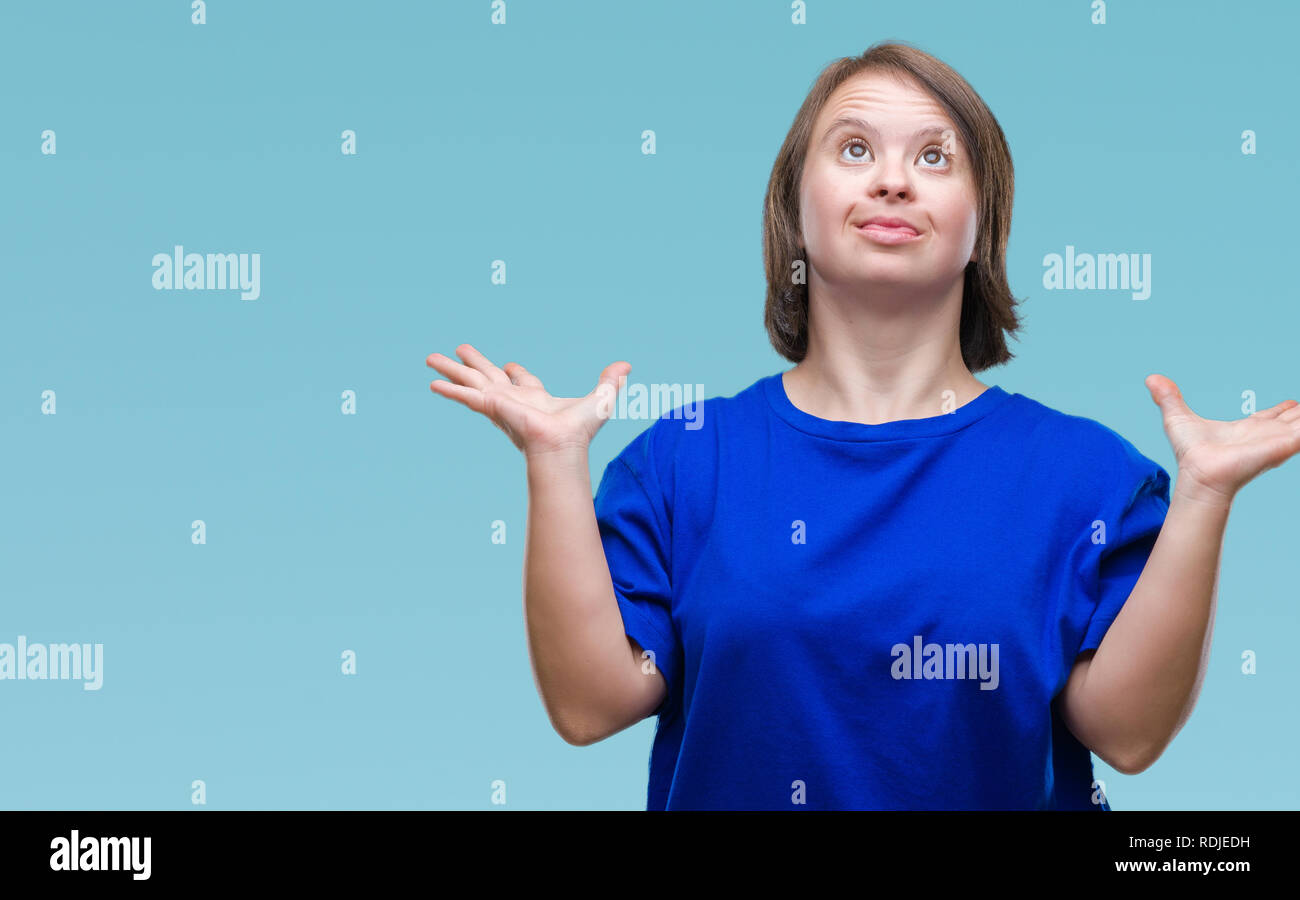 Young adult woman with down syndrome over isolated background ...