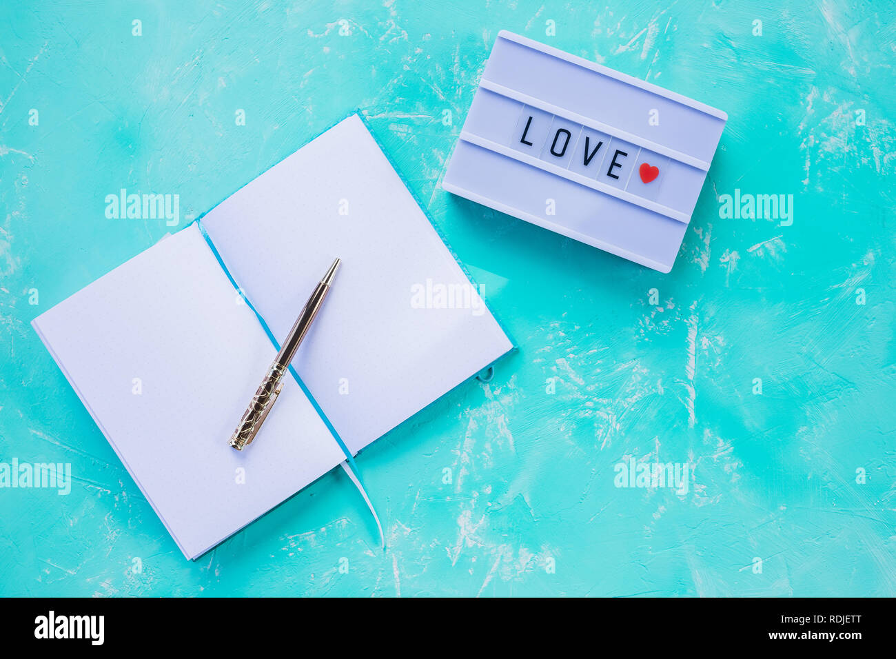 Blank page of a notebook, 14 februar,open diary and pen. Idea of ...