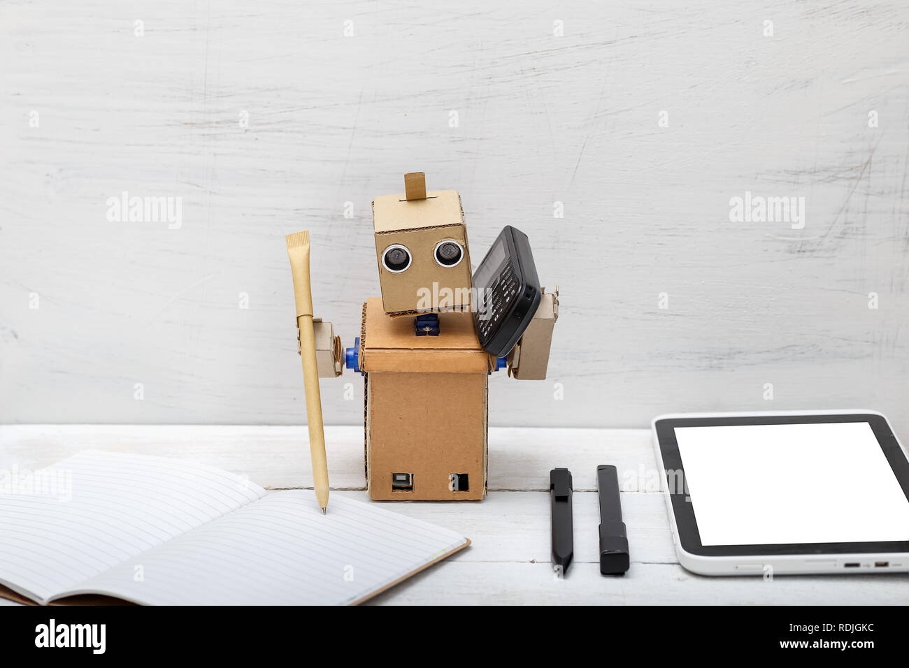 the robot works, talking on the phone and writes in a notebook Stock ...