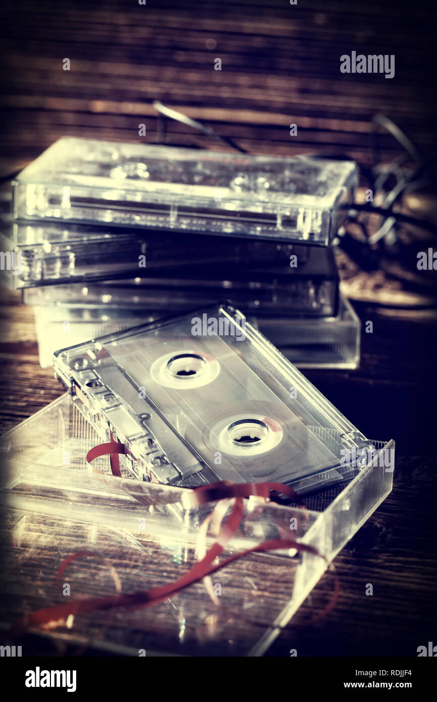 Old classic audio cassette with pulled out of tape with empty space for ...