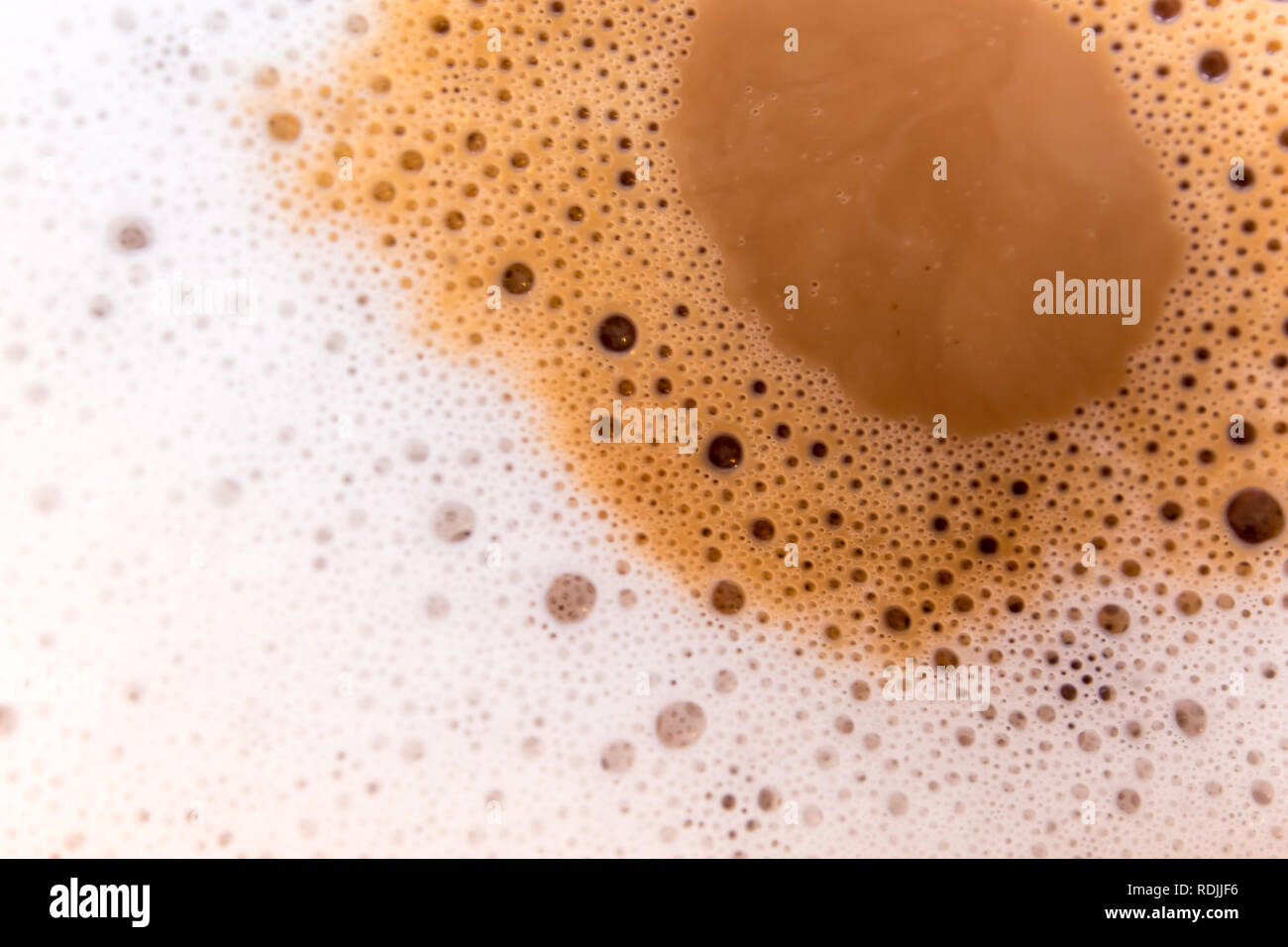 Surface texture of hot milk coffee and soft froth, close up food ...