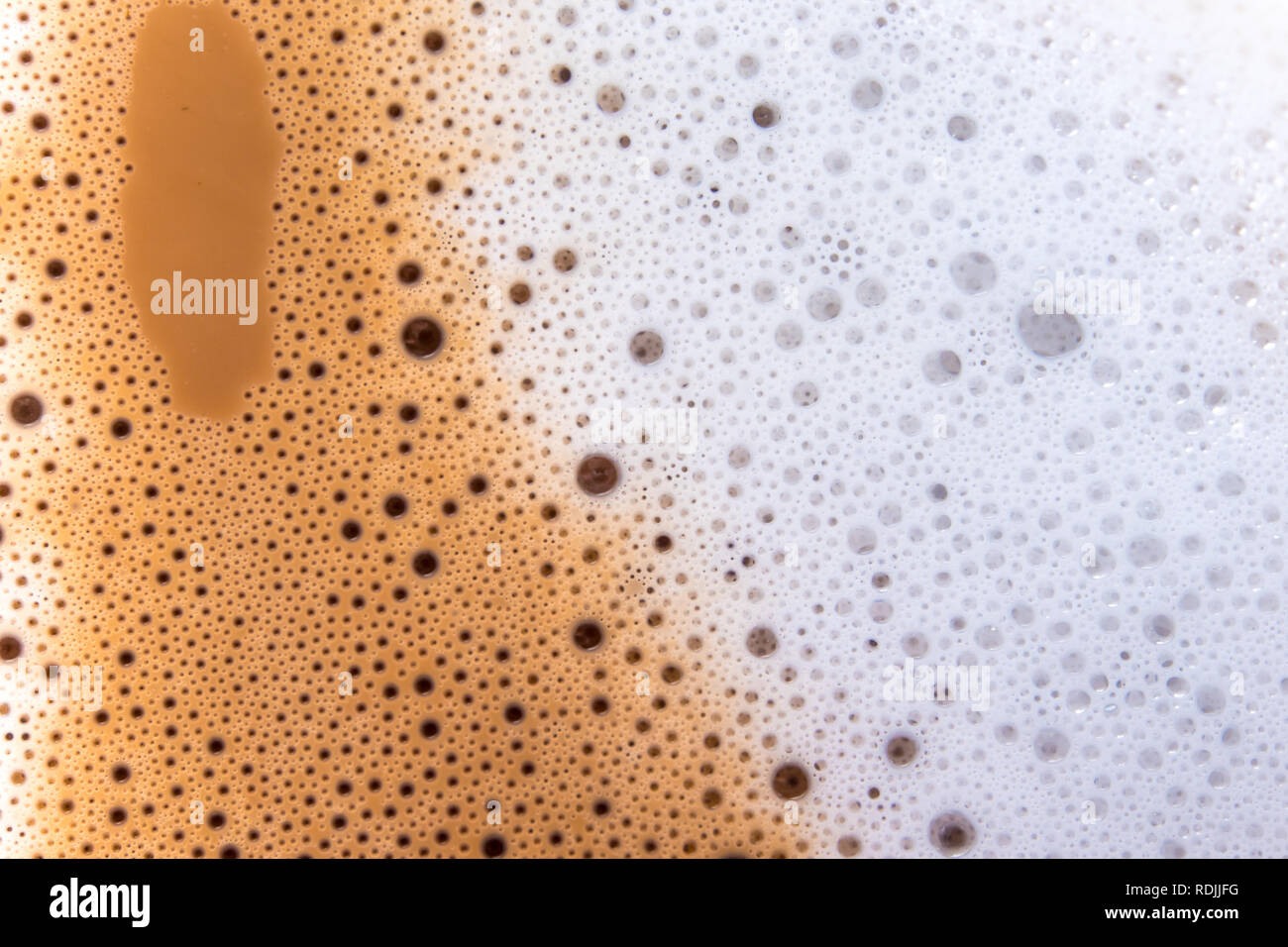 Surface texture of hot milk coffee and soft froth, close up food ...