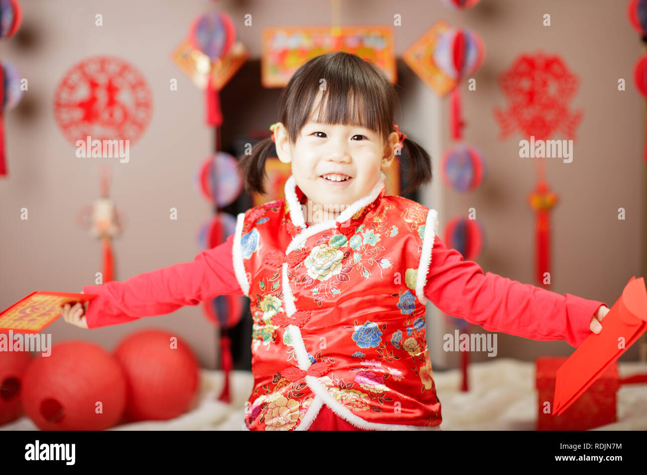 Chinese baby girl traditional dressing up with a FU means lucky red ...