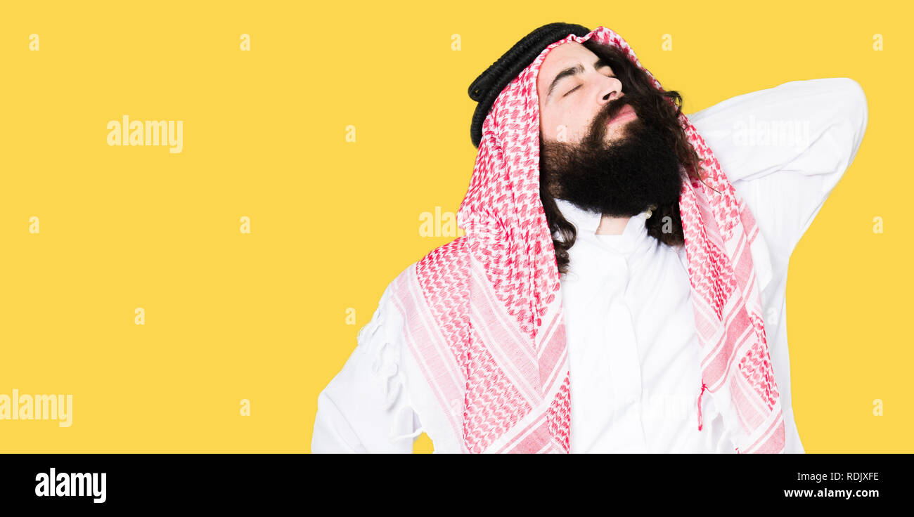 Arabian business man with long hair wearing traditional keffiyeh scarf ...