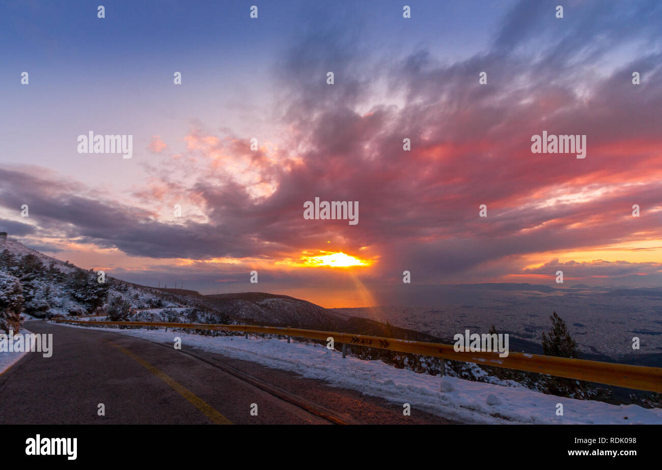 Sunset in a snowy winter day in Athens, Greece Stock Photo - Alamy