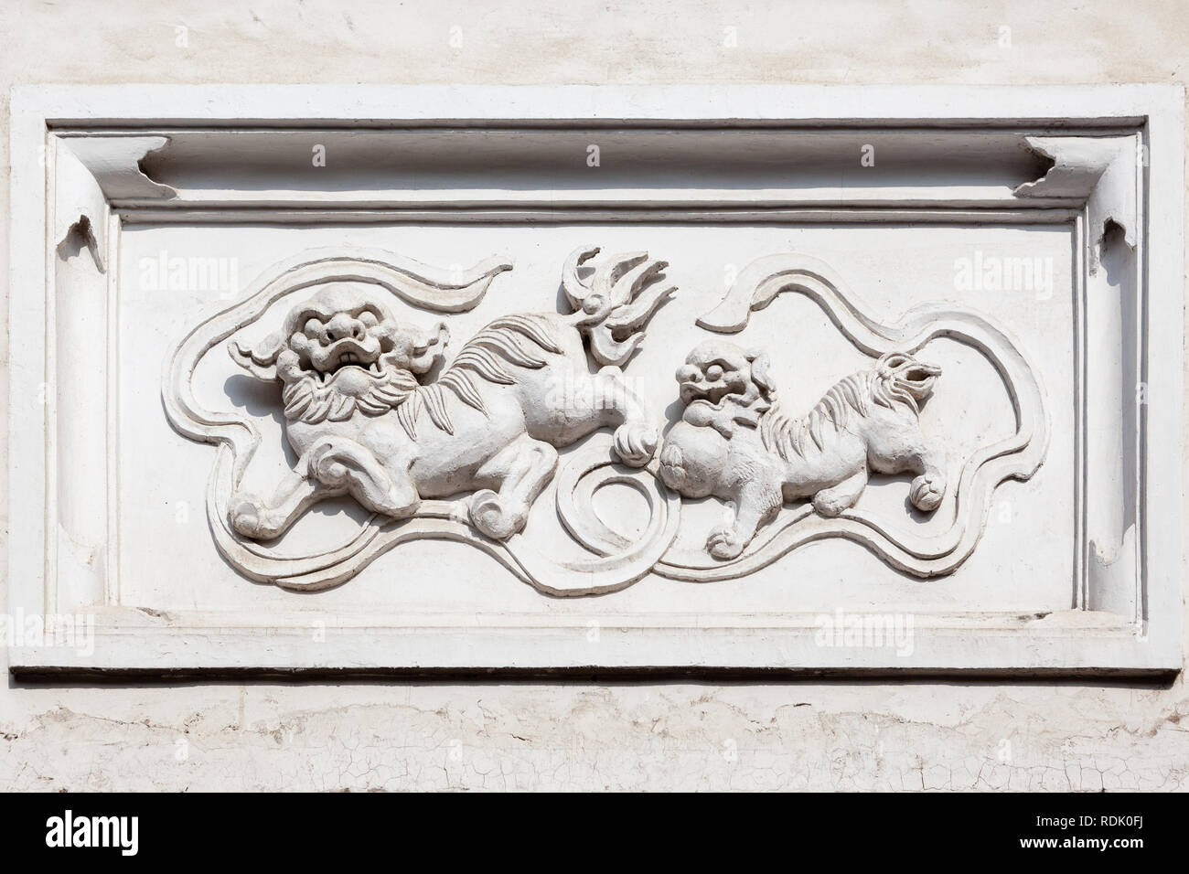 Ancient granite statue of mythological Chinese creatures Qilin on a old ...