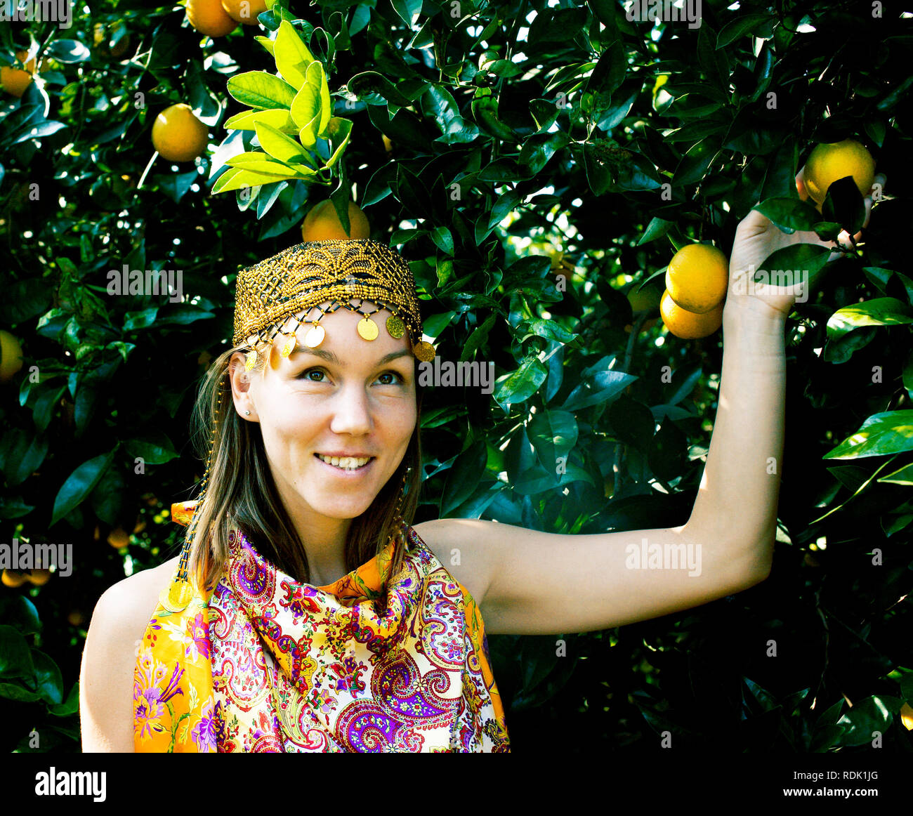 pretty islam woman in orange grove smiling, real muslim girl Stock ...