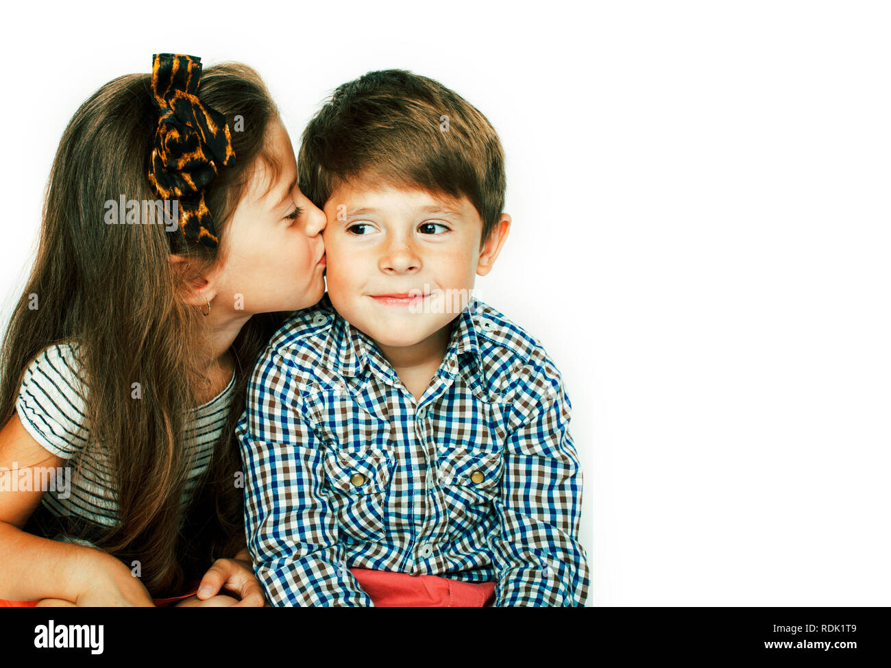 little cute boy and girl hugging playing on white background Stock ...
