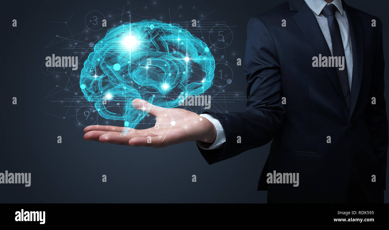Businessman holding human brain on his hand with logistics symbols ...