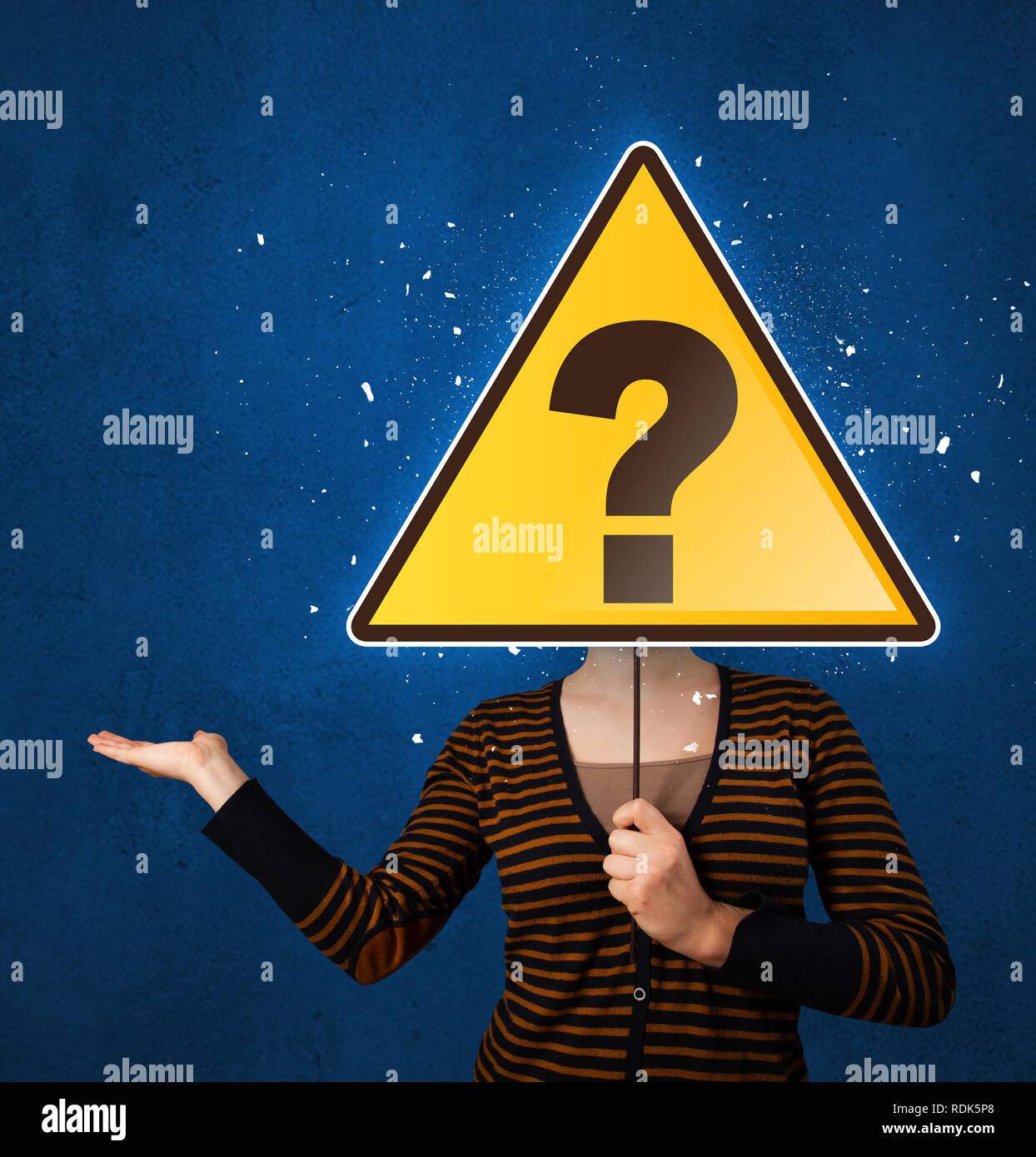 Casual young woman holding yellow sign with question mark Stock Photo ...