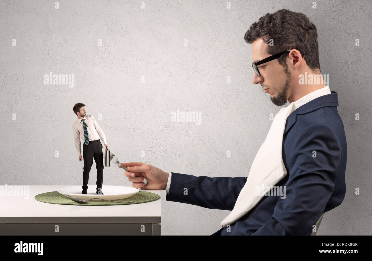 Tiny scared weak businessman almost devoured by great power Stock Photo ...