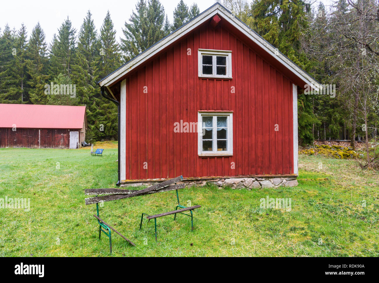 Red old cottage in the forest Stock Photo - Alamy