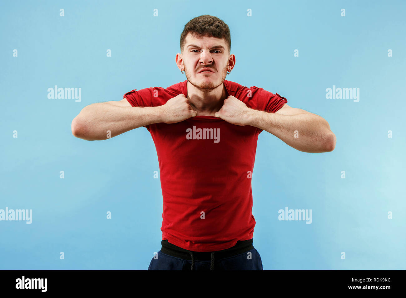 Screaming, hate, rage. Crying emotional angry man screaming on blue ...