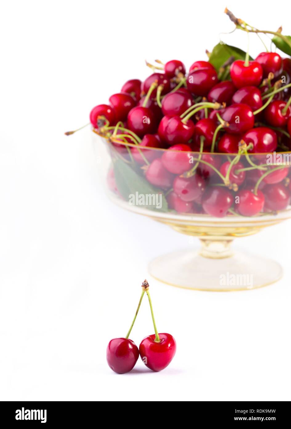 red cherry on a white background Stock Photo - Alamy