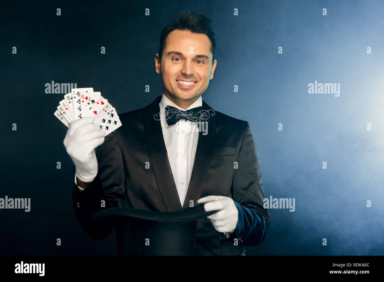 Male magician in black suit hi-res stock photography and images - Alamy