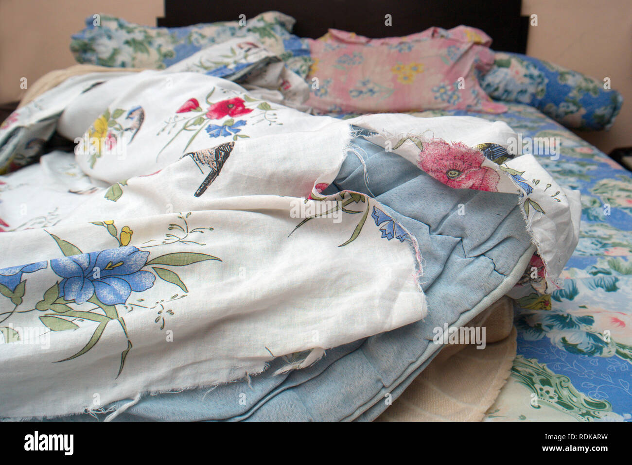 Absolutely messy unmade bed with ripped down bedding, indoor closeup ...