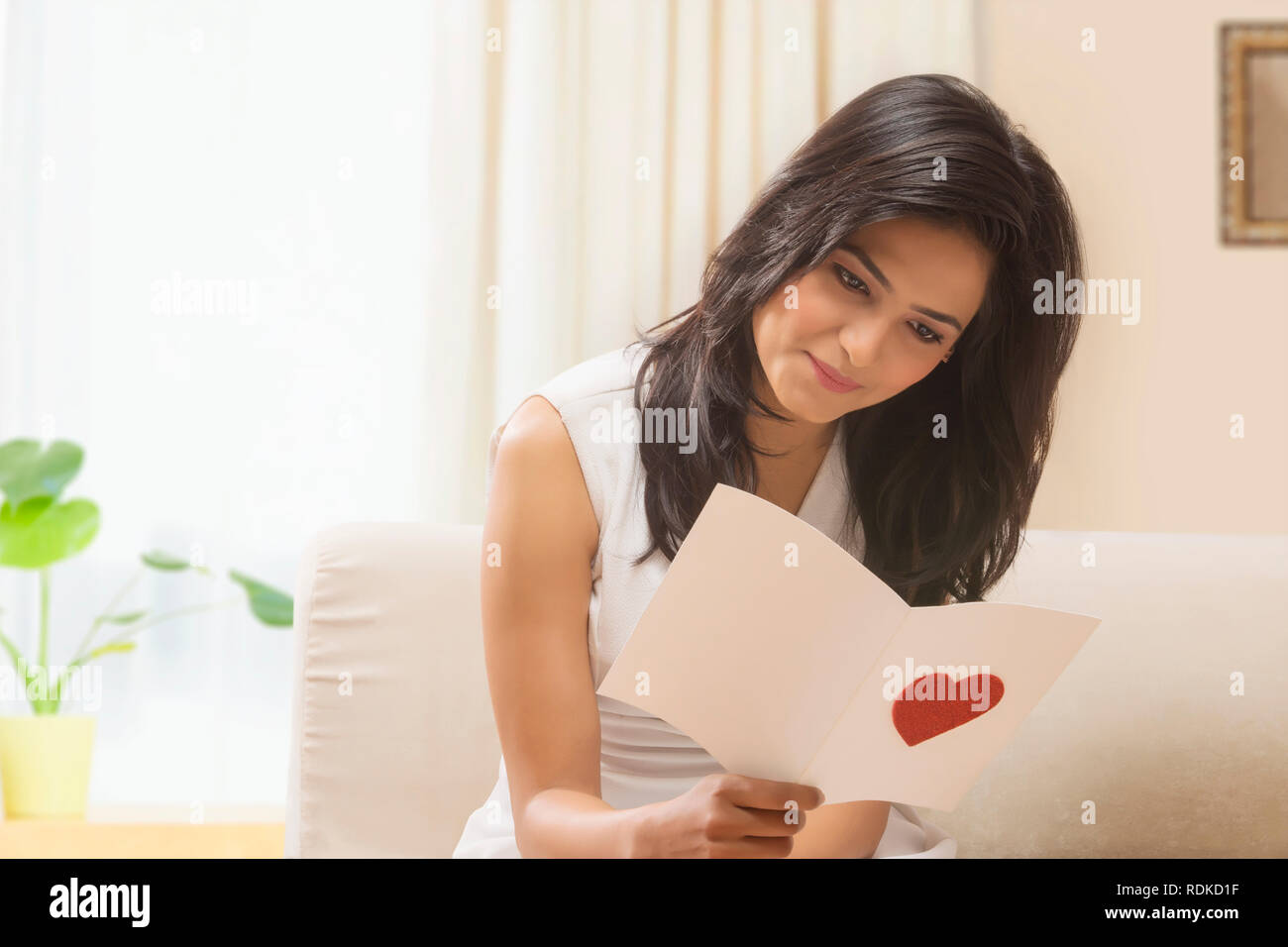 Woman reading greeting card hi-res stock photography and images - Alamy