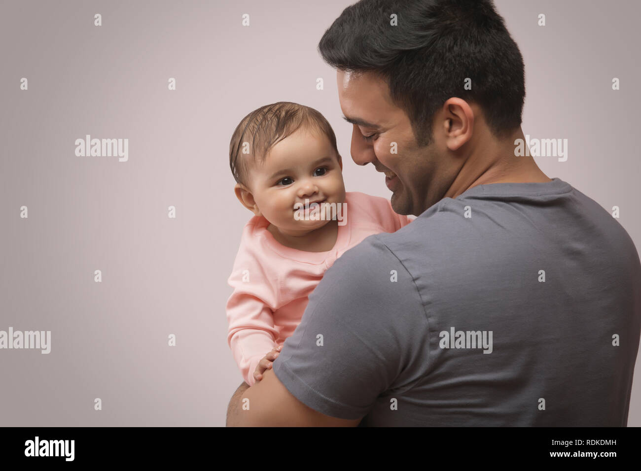 Smiling Father Playing baby girl Stock Photo - Alamy Smiling Father Playing baby girl Stock Photo - Alamy