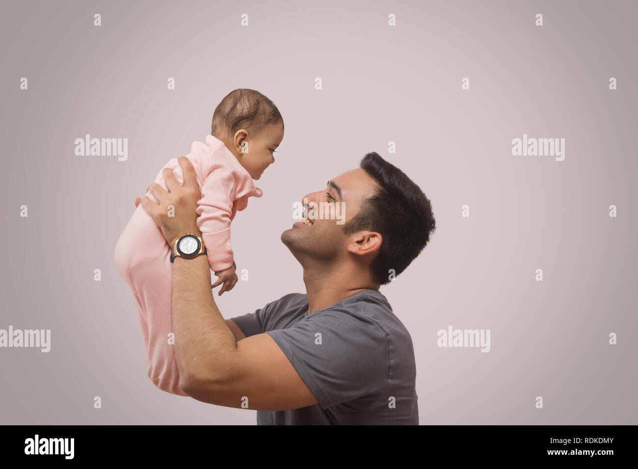 Father lifting baby daughter hi-res stock photography and images - Alamy