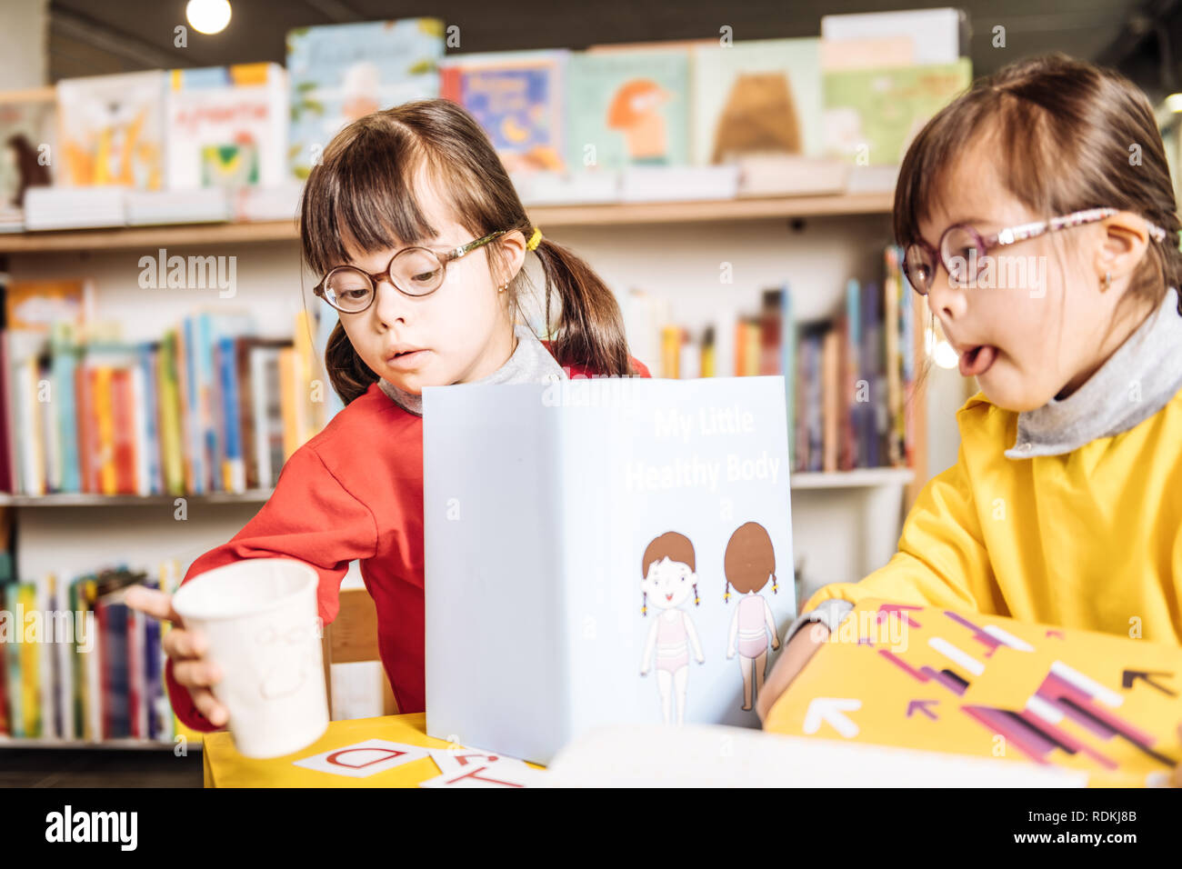 Two girls reading letters hi-res stock photography and images - Alamy