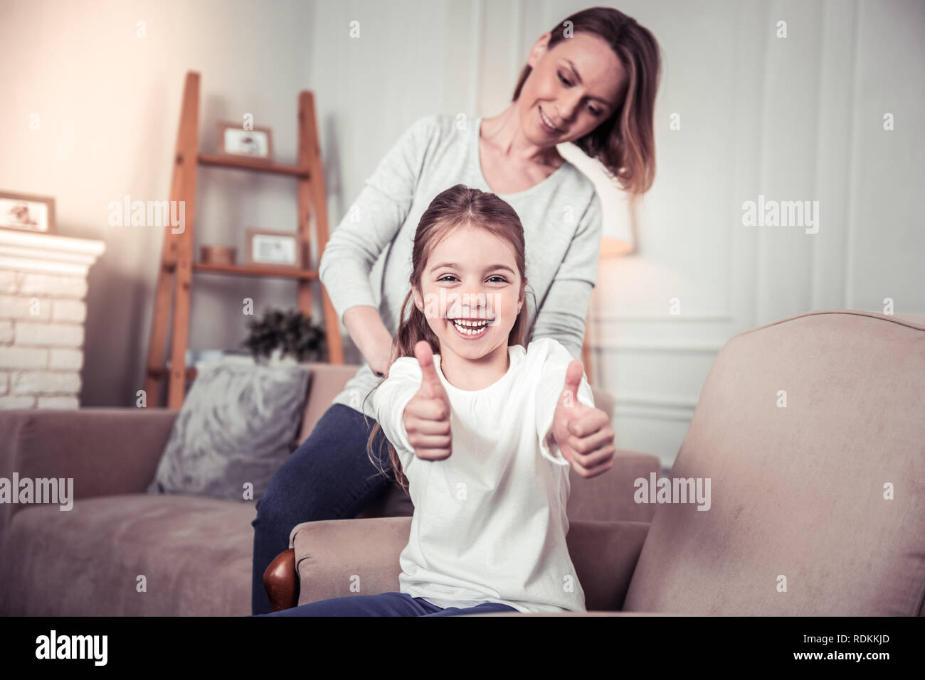 Cheerful positive girl showing you Ok signs Stock Photo - Alamy