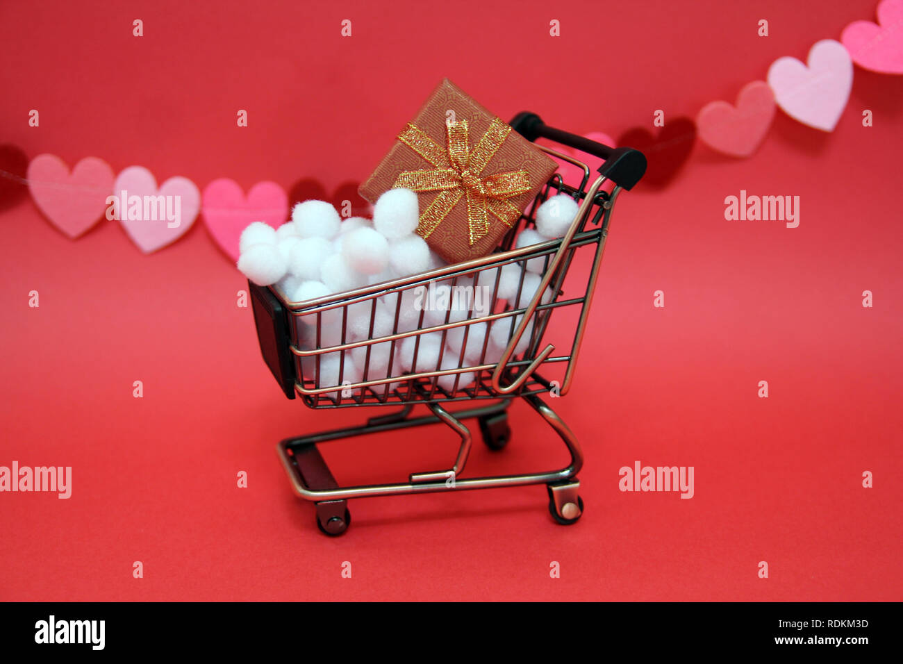 Gift box with red theme Stock Photo - Alamy