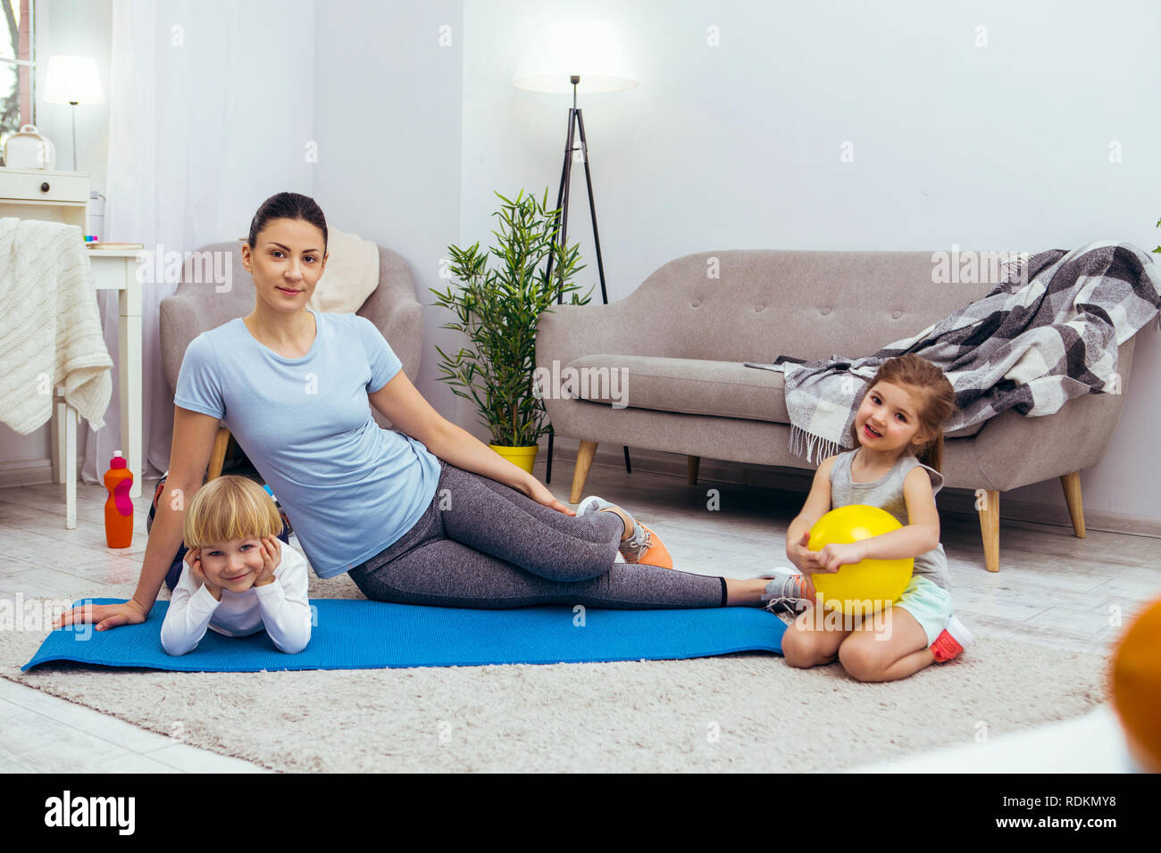 Positive nice active family looking at you Stock Photo - Alamy