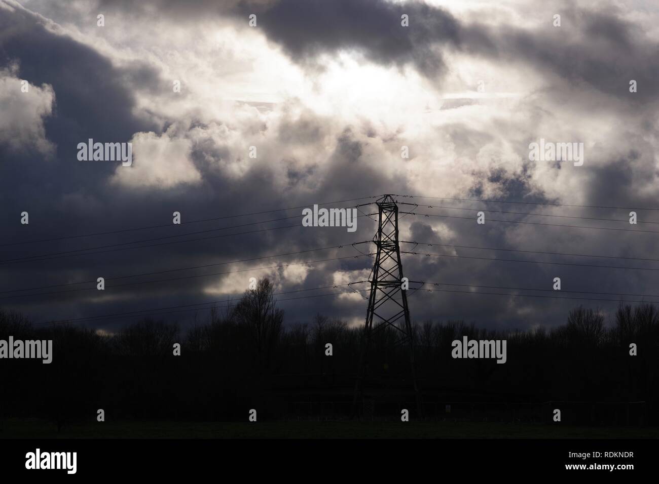 Silhouetted National Grid Electricity Pylon against a Dramatic Wintery ...