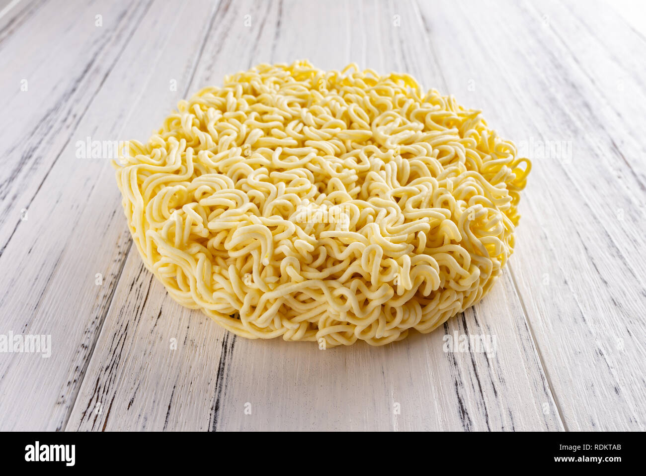 side view instant noodles or dried noodles on white wood background ...