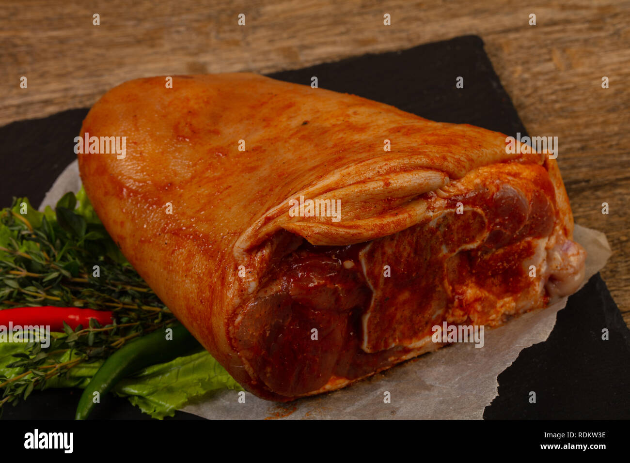 Raw pork knuckle marinated for cooking Stock Photo - Alamy
