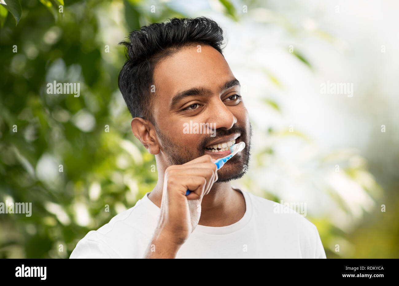 indian man with toothbrush cleaning teeth Stock Photo - Alamy
