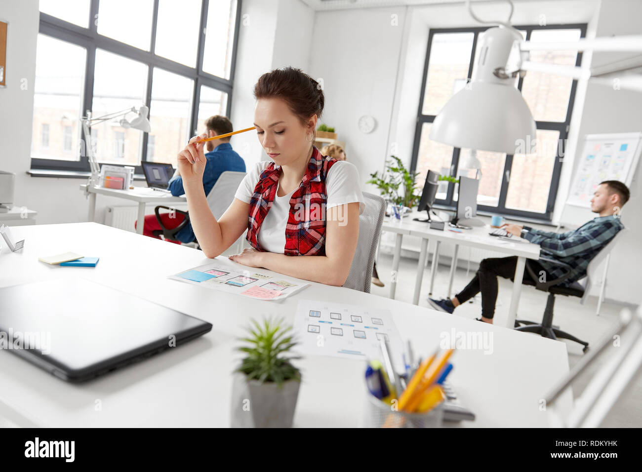 creative woman working on user interface at office Stock Photo - Alamy