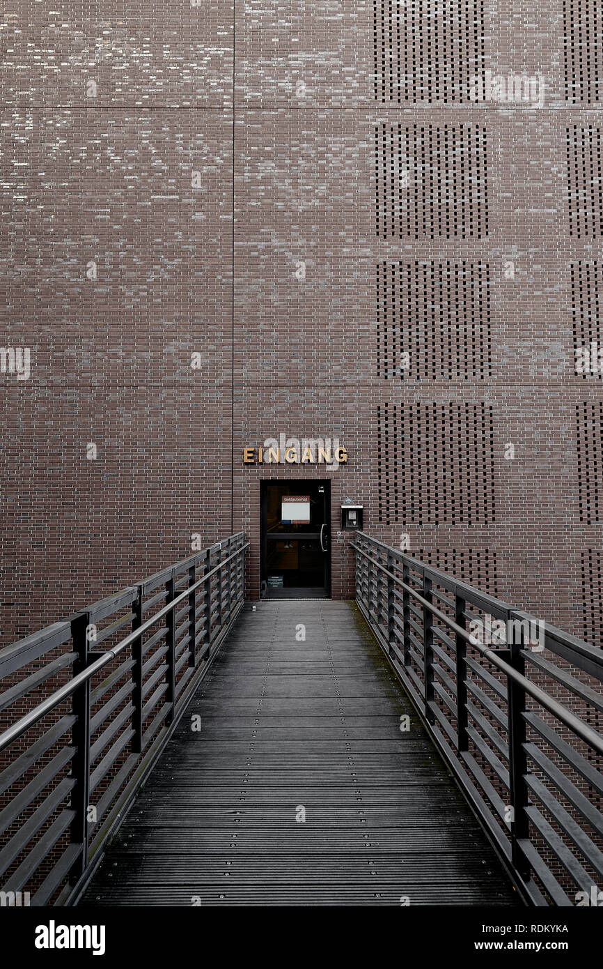 Bridge to a Brick wall with a door to open Stock Photo - Alamy