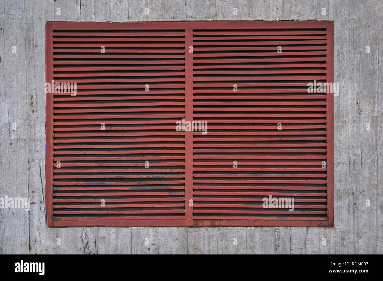 Iron brown closed window on concrete texture urban rough structure ...