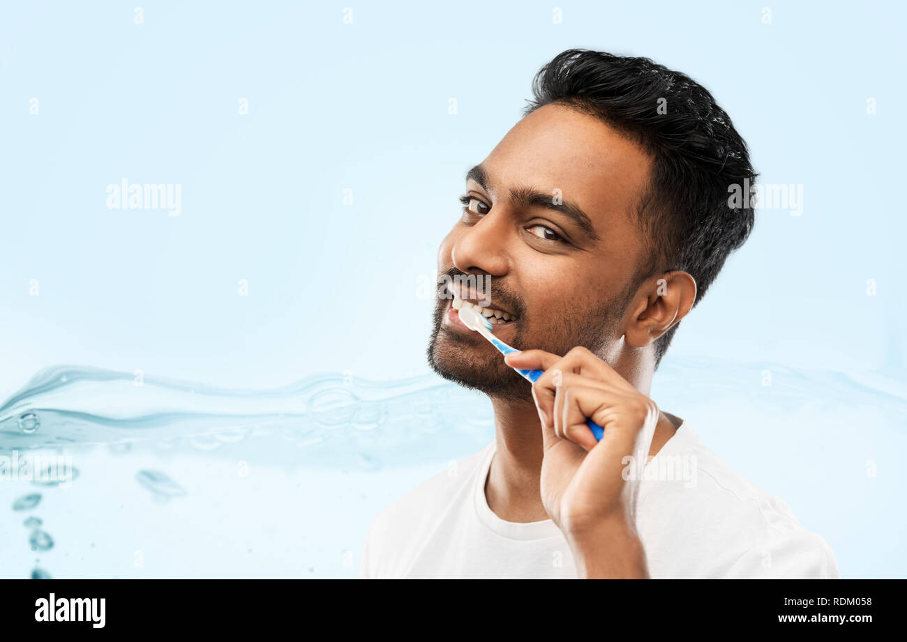 indian man with toothbrush cleaning teeth Stock Photo - Alamy