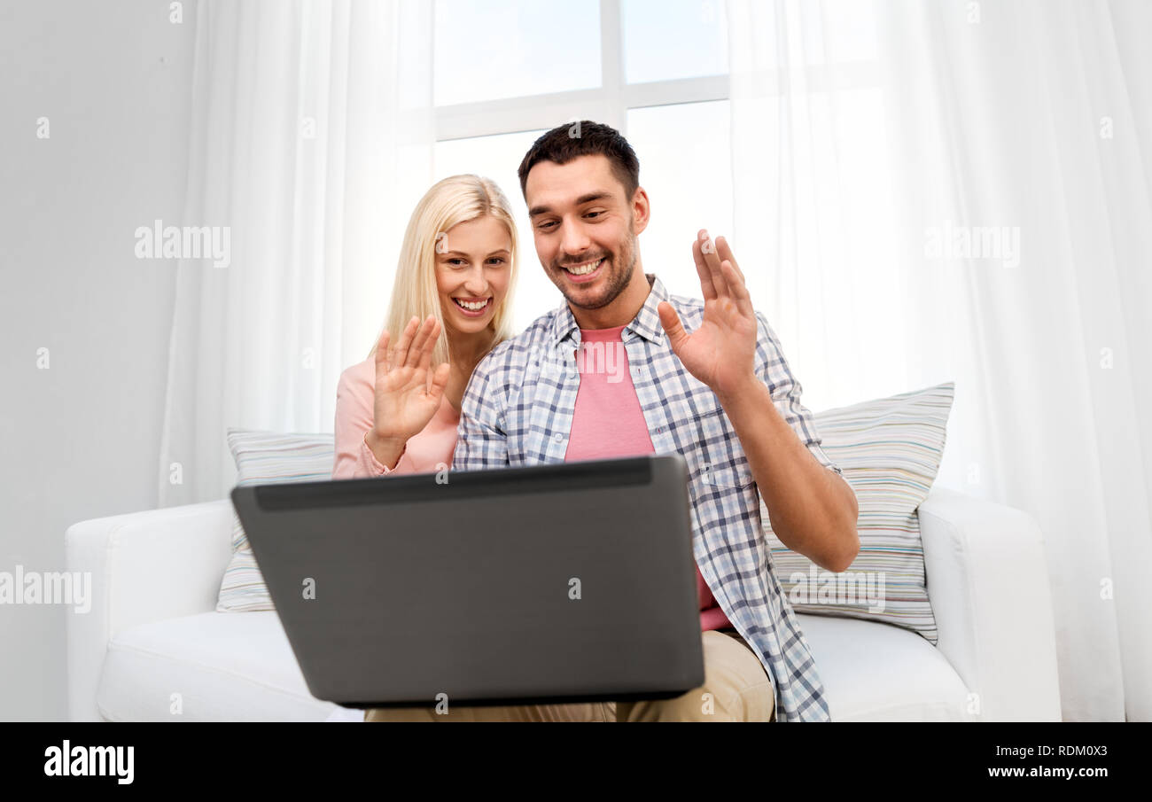 couple with laptop having video call at home Stock Photo - Alamy