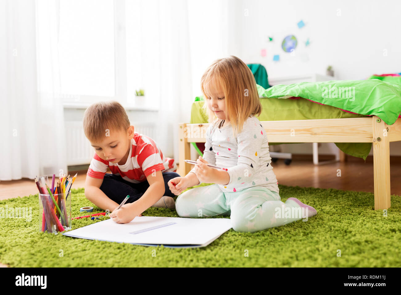 happy kids drawing at home Stock Photo - Alamy