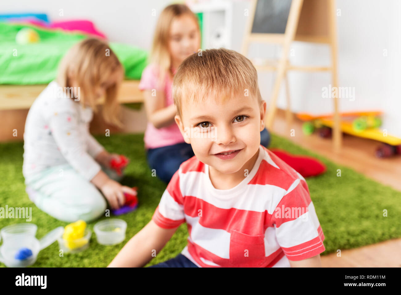 boy and other children playing at home Stock Photo - Alamy