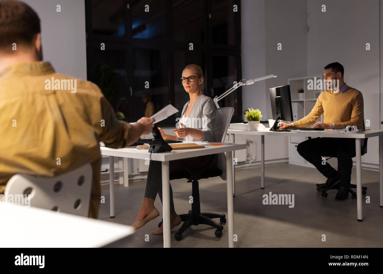 business people working late at night office Stock Photo - Alamy