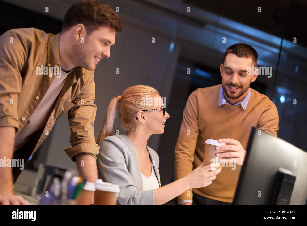 business team with coffee working at night office Stock Photo - Alamy